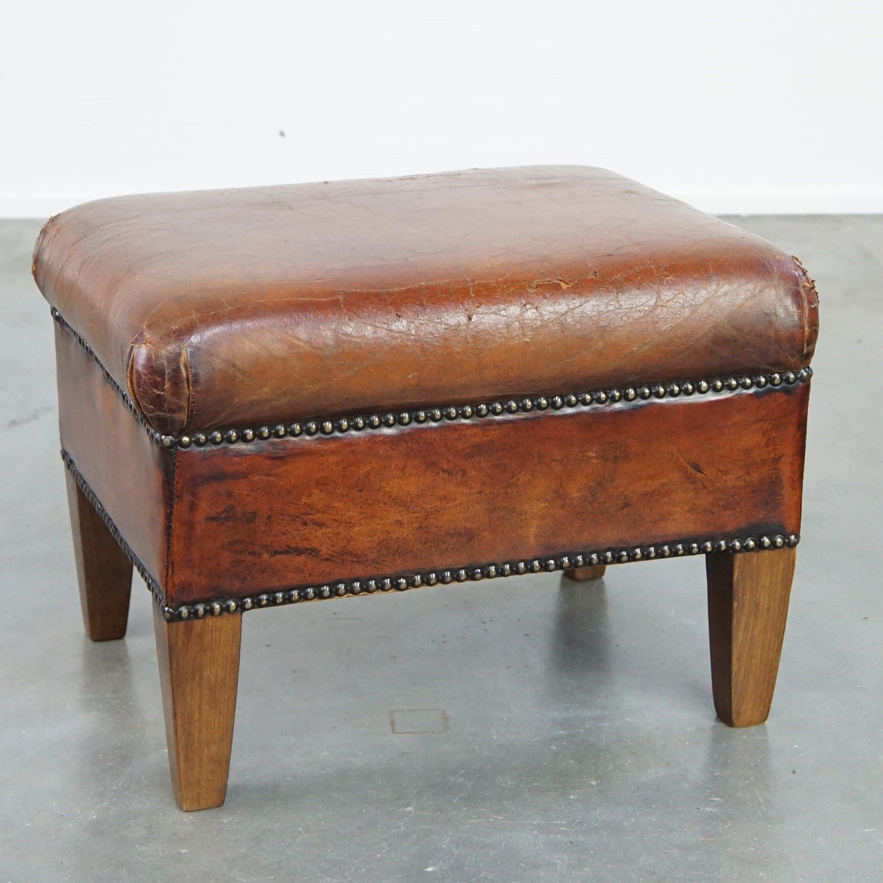 Vintage Sheepskin Leather Hocker With Ornamental Nails | €350 | Whoppah