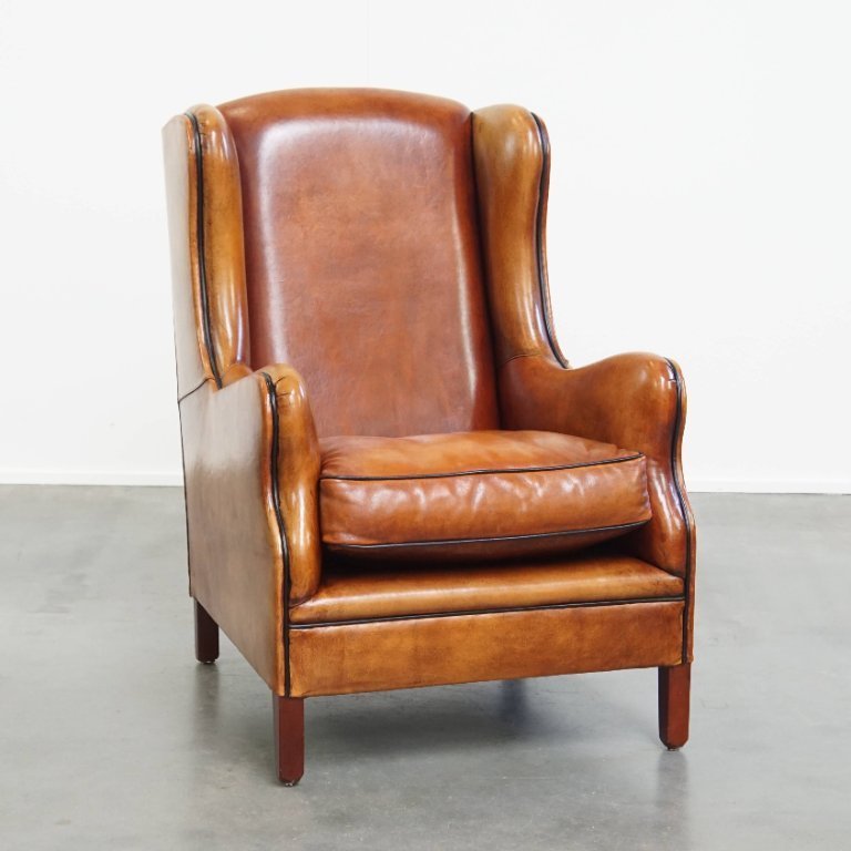 Sheep leather ear chair/ armchair with black piping | €1,060 | Whoppah