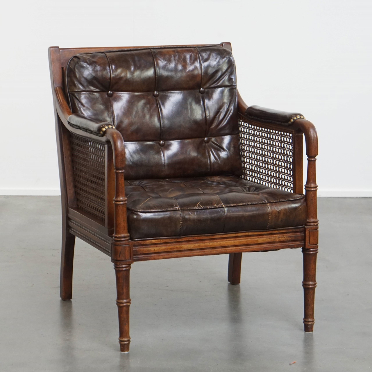 Vintage design armchair with wicker, wood and leather | €470 | Whoppah