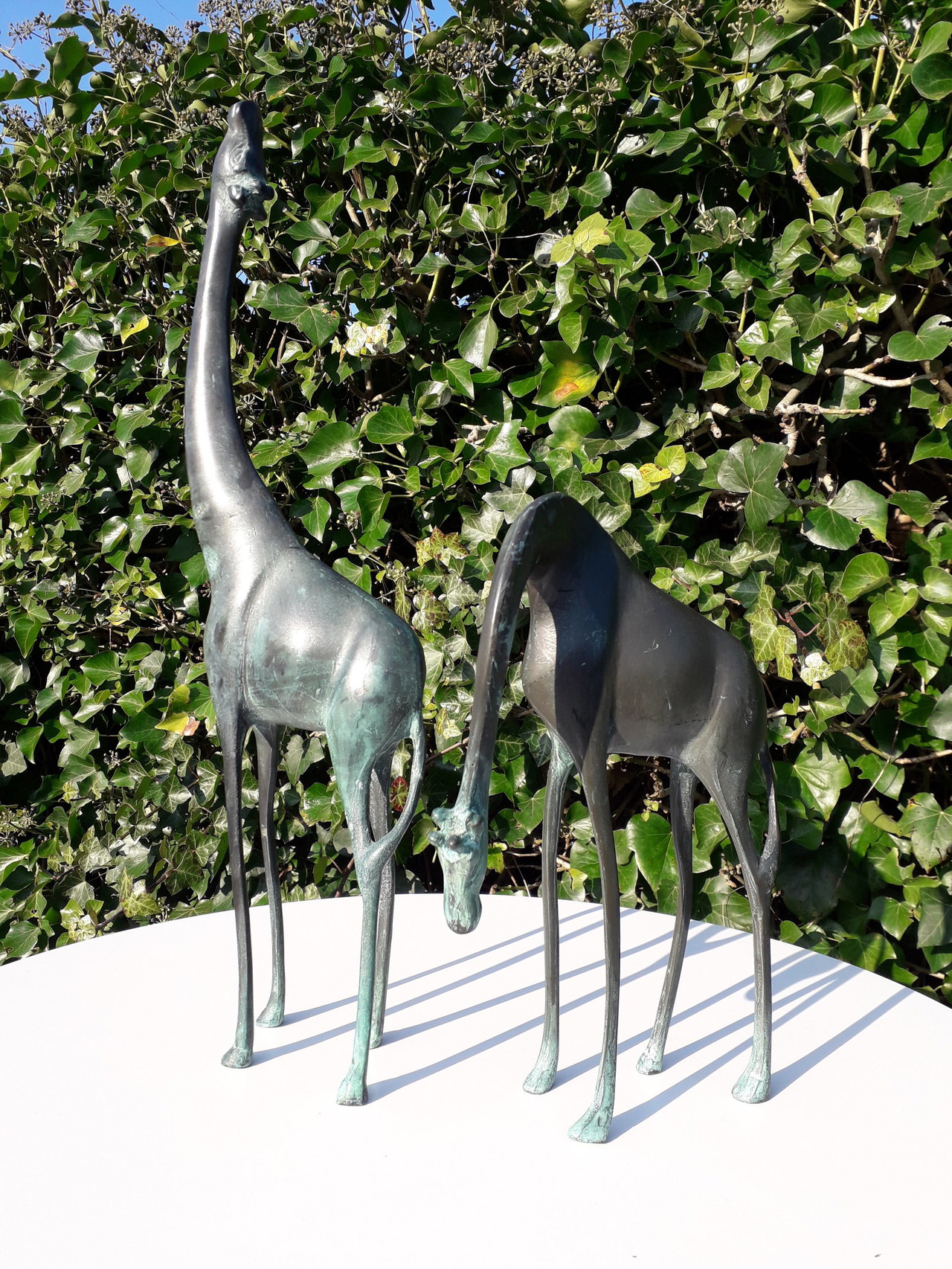 2 copper figurines of giraffes 46 and 36.5 cm high | €250 | Whoppah