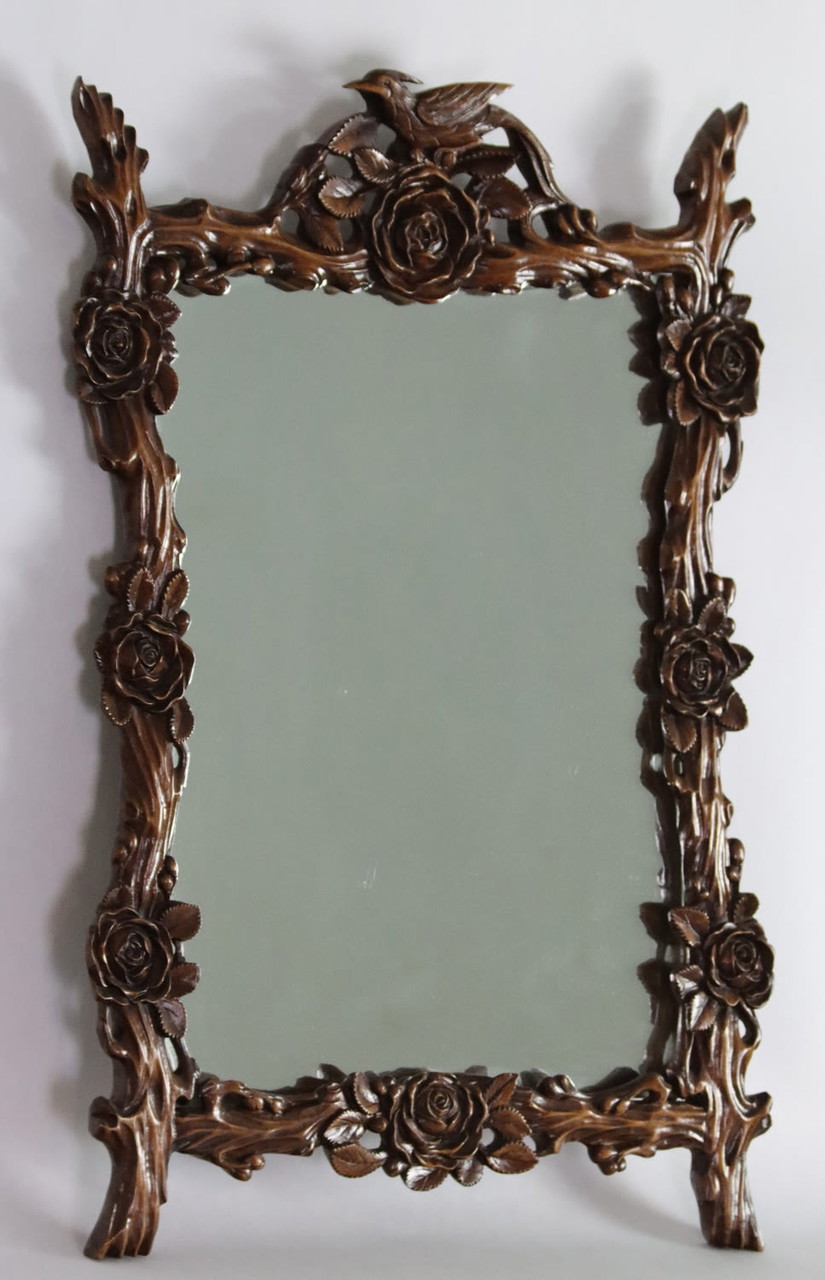 Chinese mirror shaped with carved flowers and branches | €150 | Whoppah