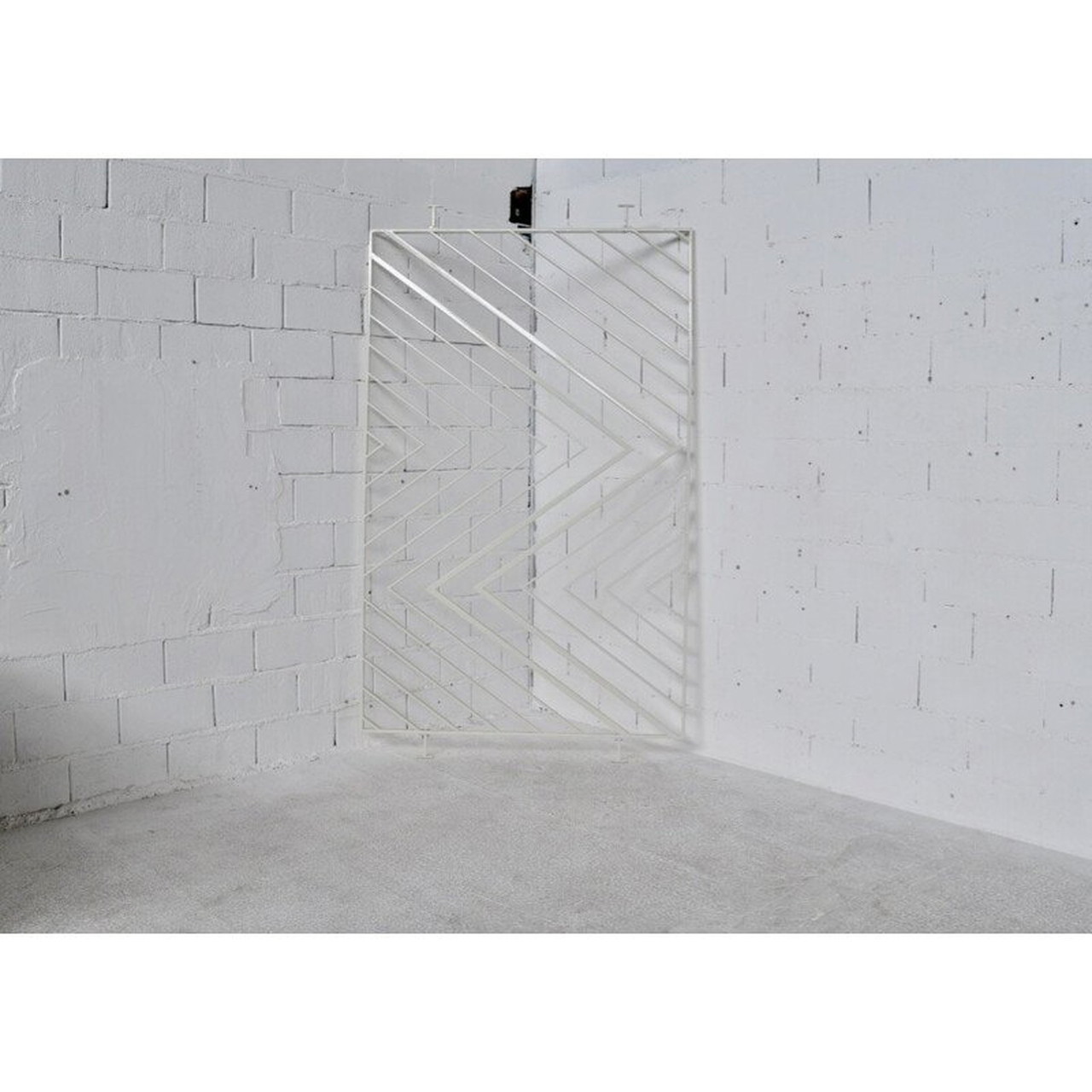 Vintage partition grille with geometric patterns in lacquered steel ...