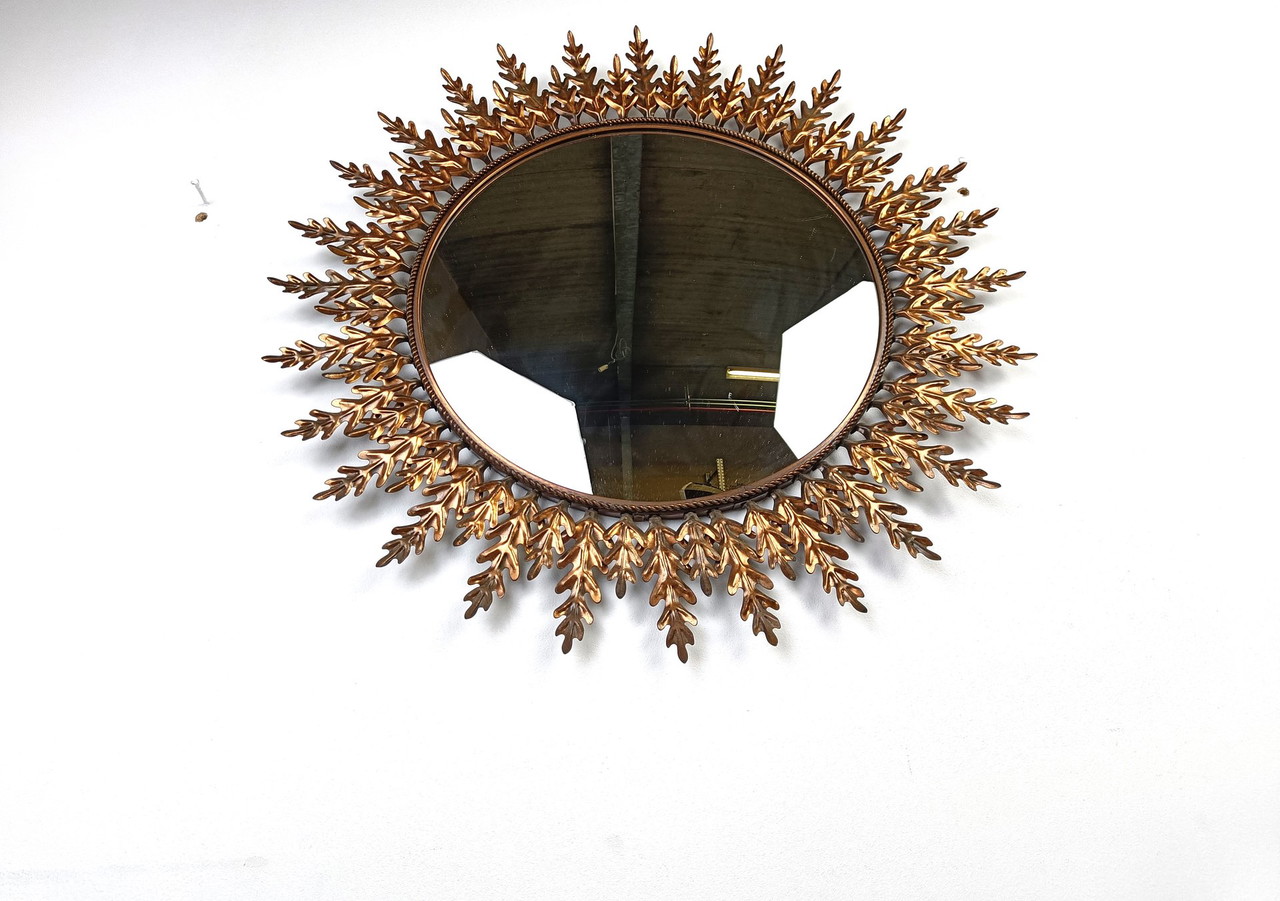 Vintage copper sunburst mirror | €395 | Whoppah